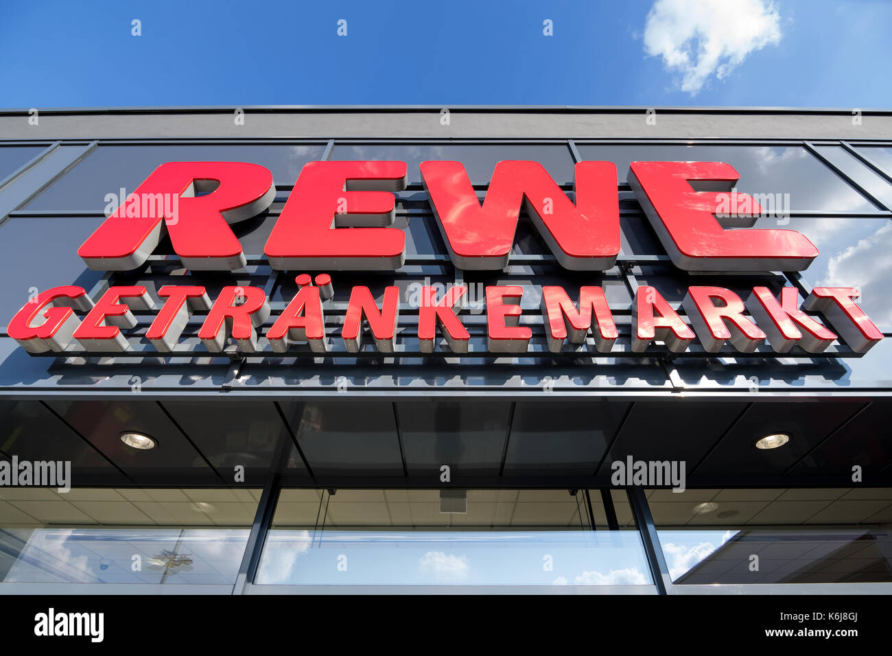 Sign at REWE beverage store. REWE is a large supermarket chain in ...