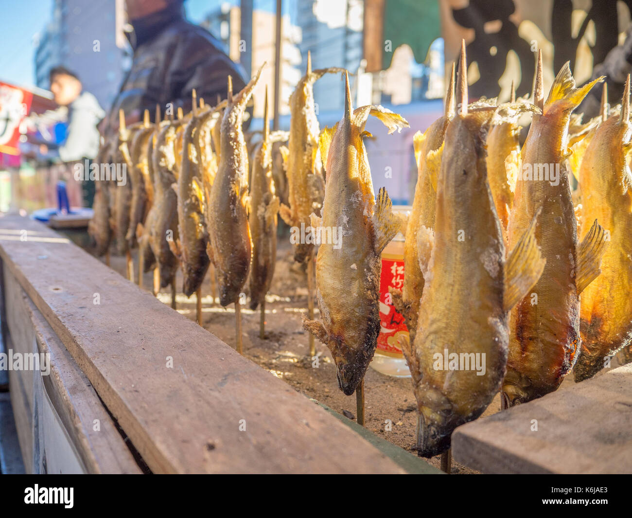 TOKYO, JAPAN - AUGUST 5 2017: Japanese street food, fish in a stick in ...
