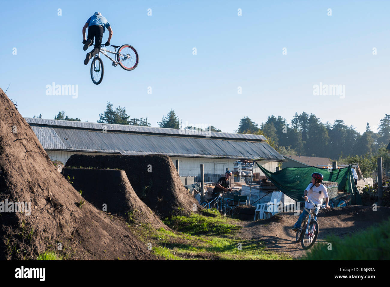 Rider doing bicycle trick mid air, Aptos, California, USA Stock Photo ...