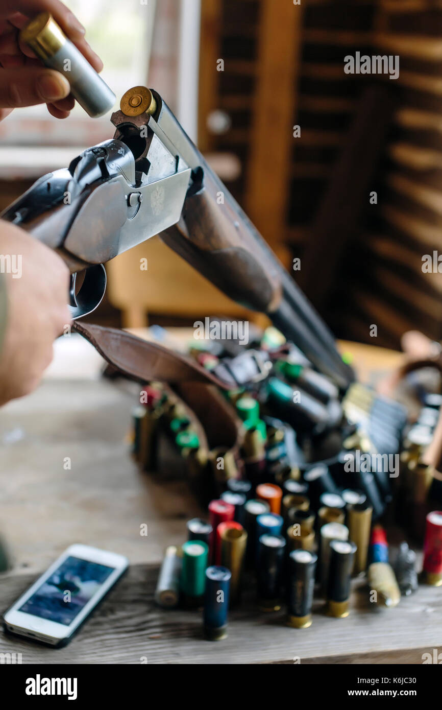 Man loading shells into shotgun, Tikhvin, Saint Petersburg, Russia ...