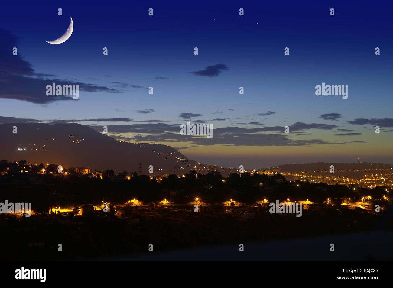 Night scene showing the street lighting at sunrise. City of Nice in ...