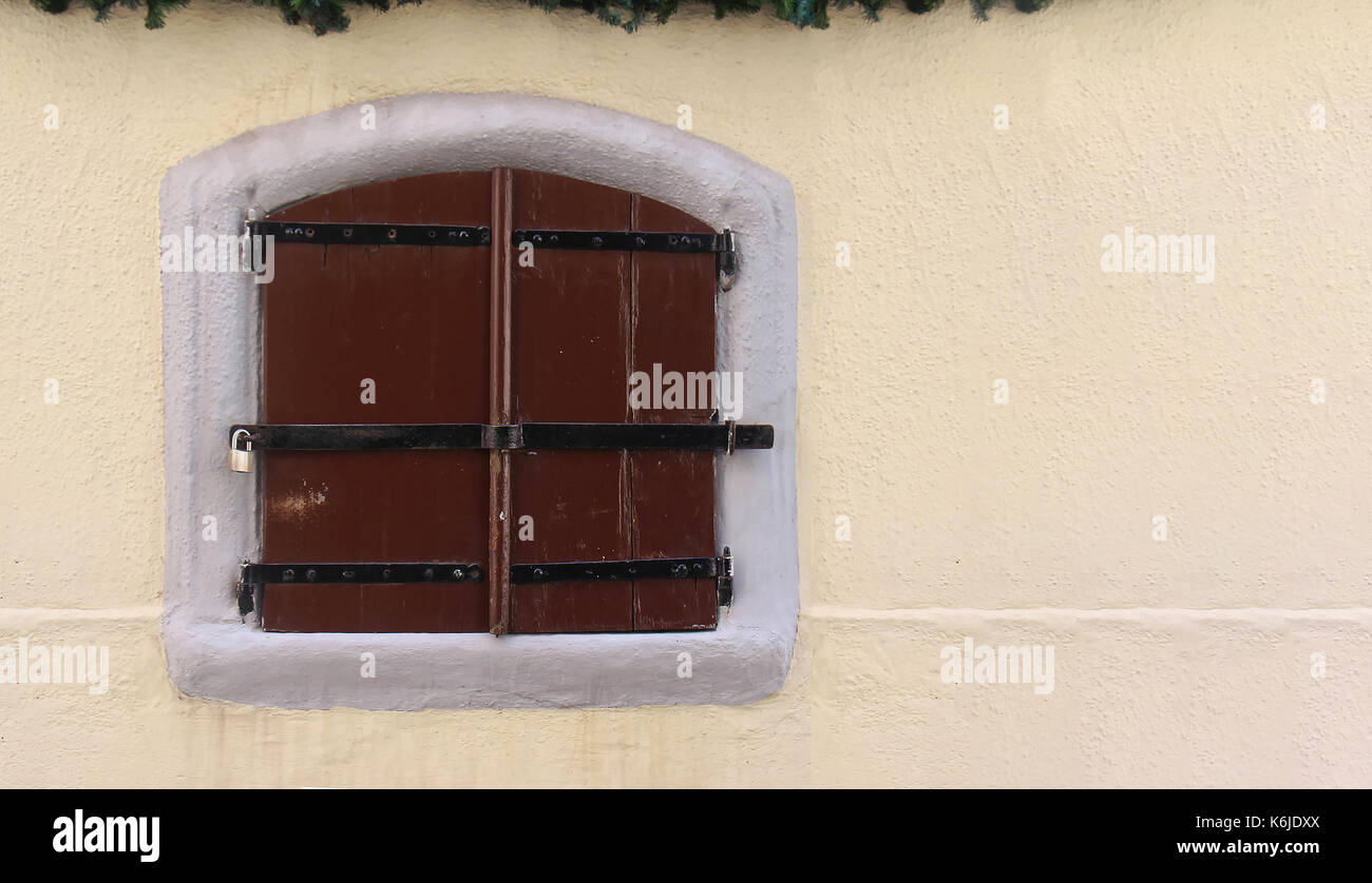 Retro window on old house facade with closed wooden blinds Stock Photo ...