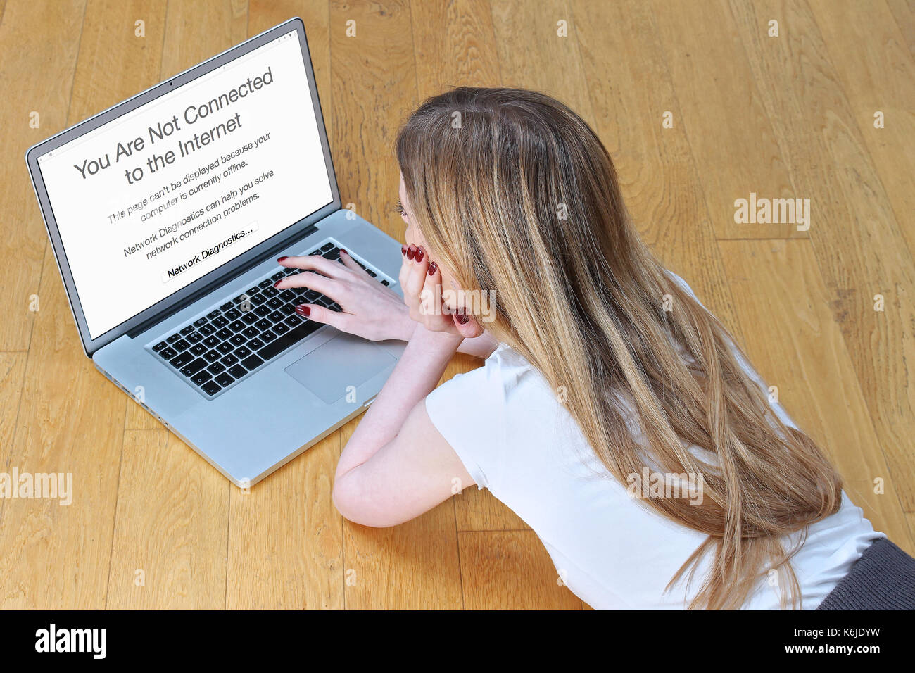 Young girl looking at her laptop upset because of first world problem ...