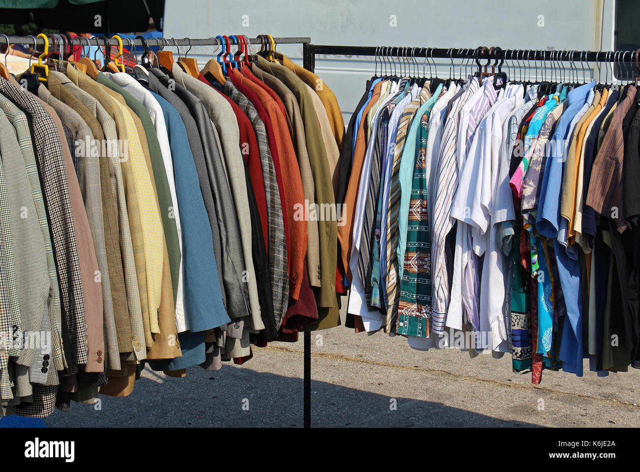 Second hand worn clothes sold on flea market Stock Photo - Alamy