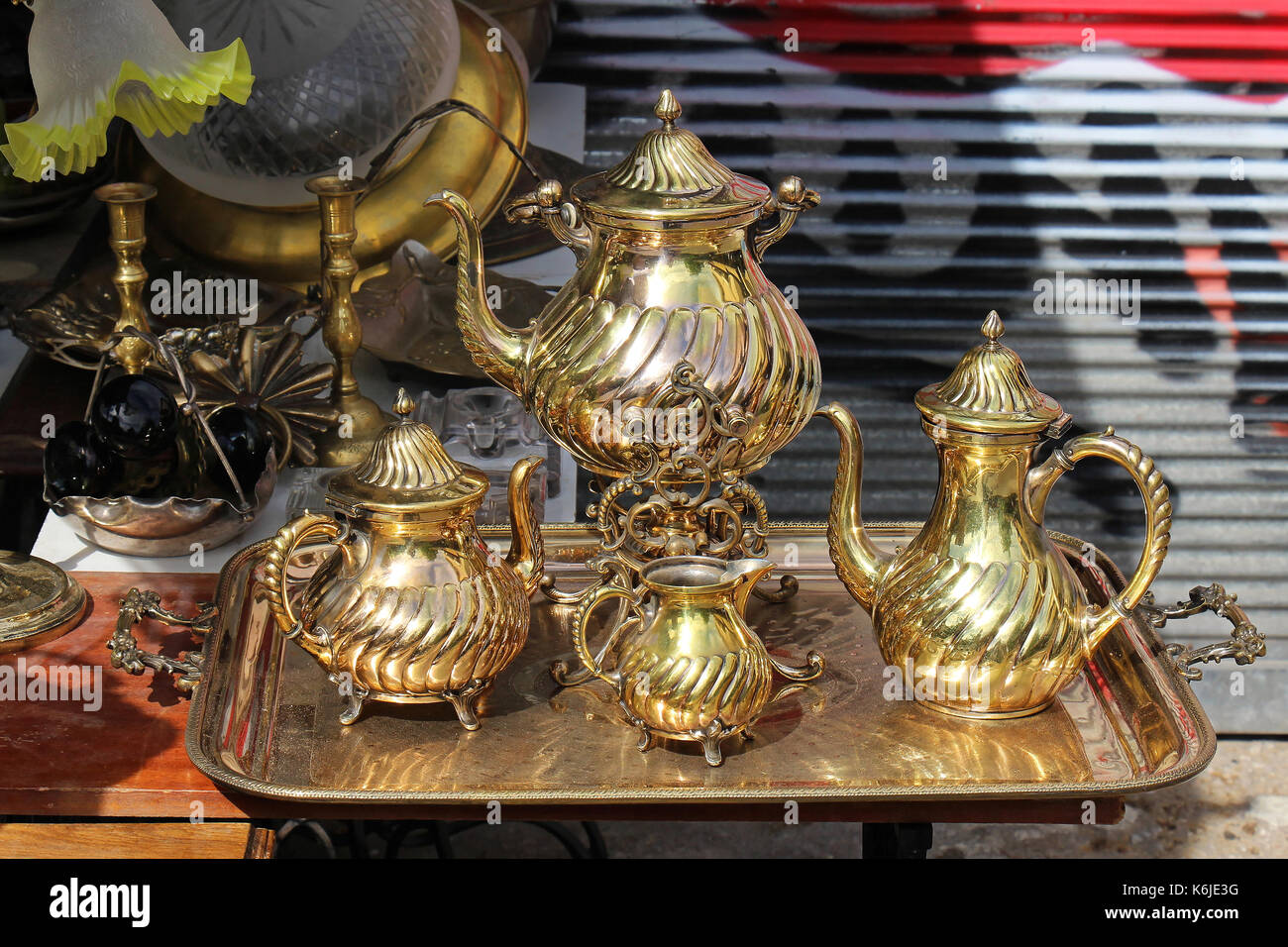 Vintage gold tea set on antiques fair Stock Photo - Alamy