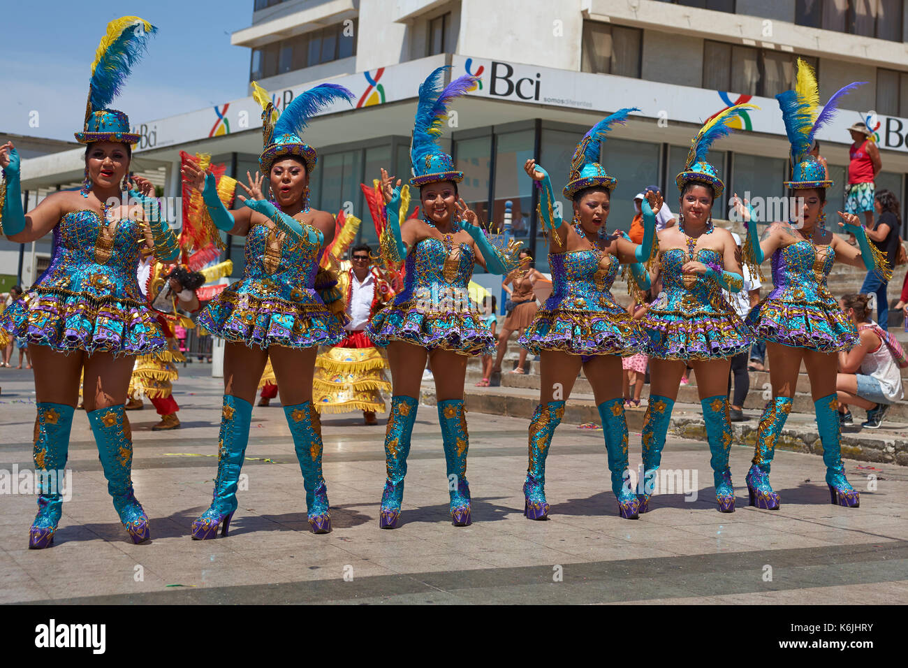 Female members of a Morenada dance group in ornate costumes performing ...