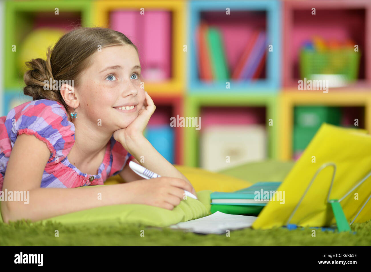 Cute schoolgirl doing homework Stock Photo - Alamy