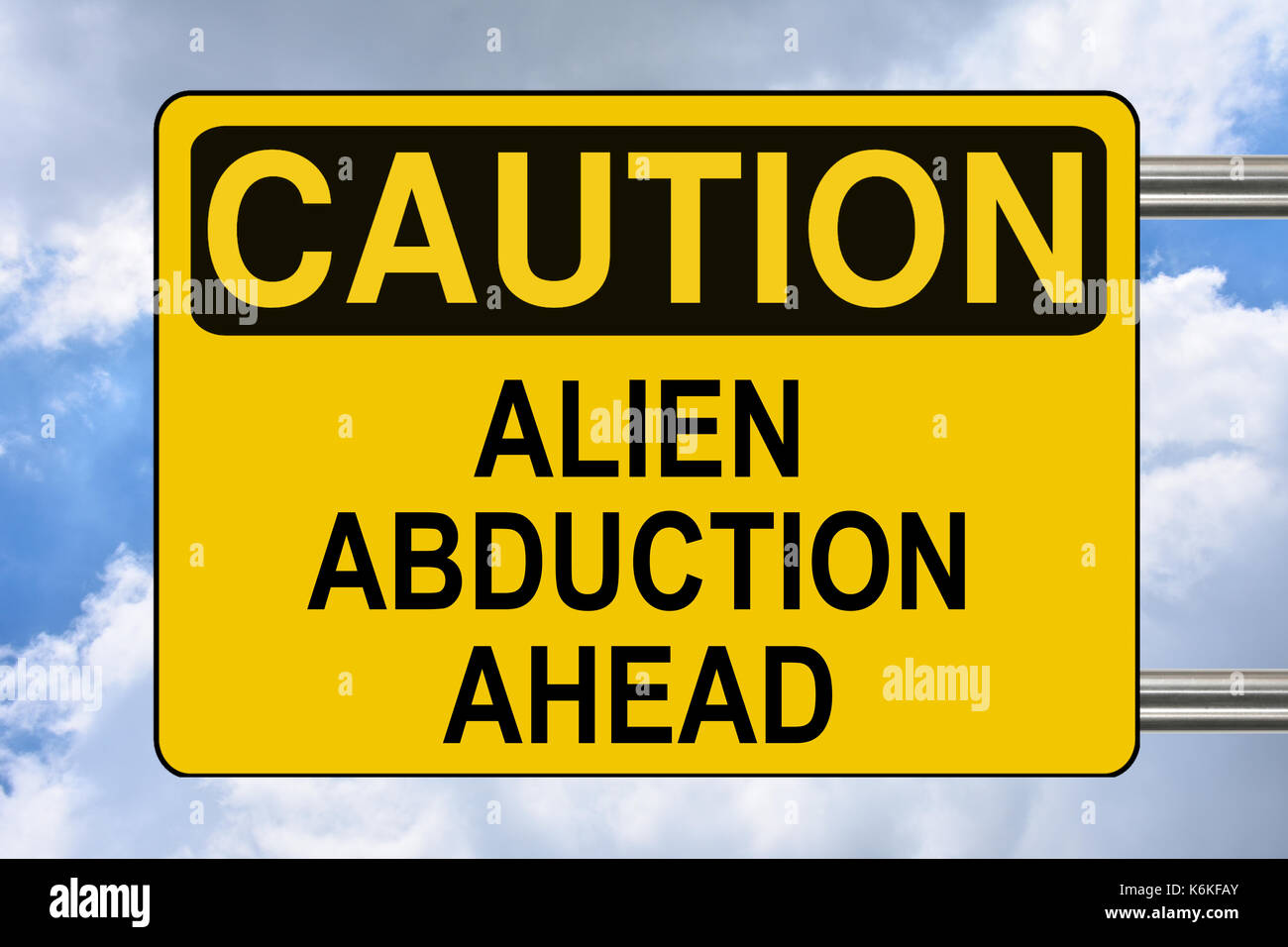 Alien abduction ahead, yellow warning road sign Stock Photo - Alamy