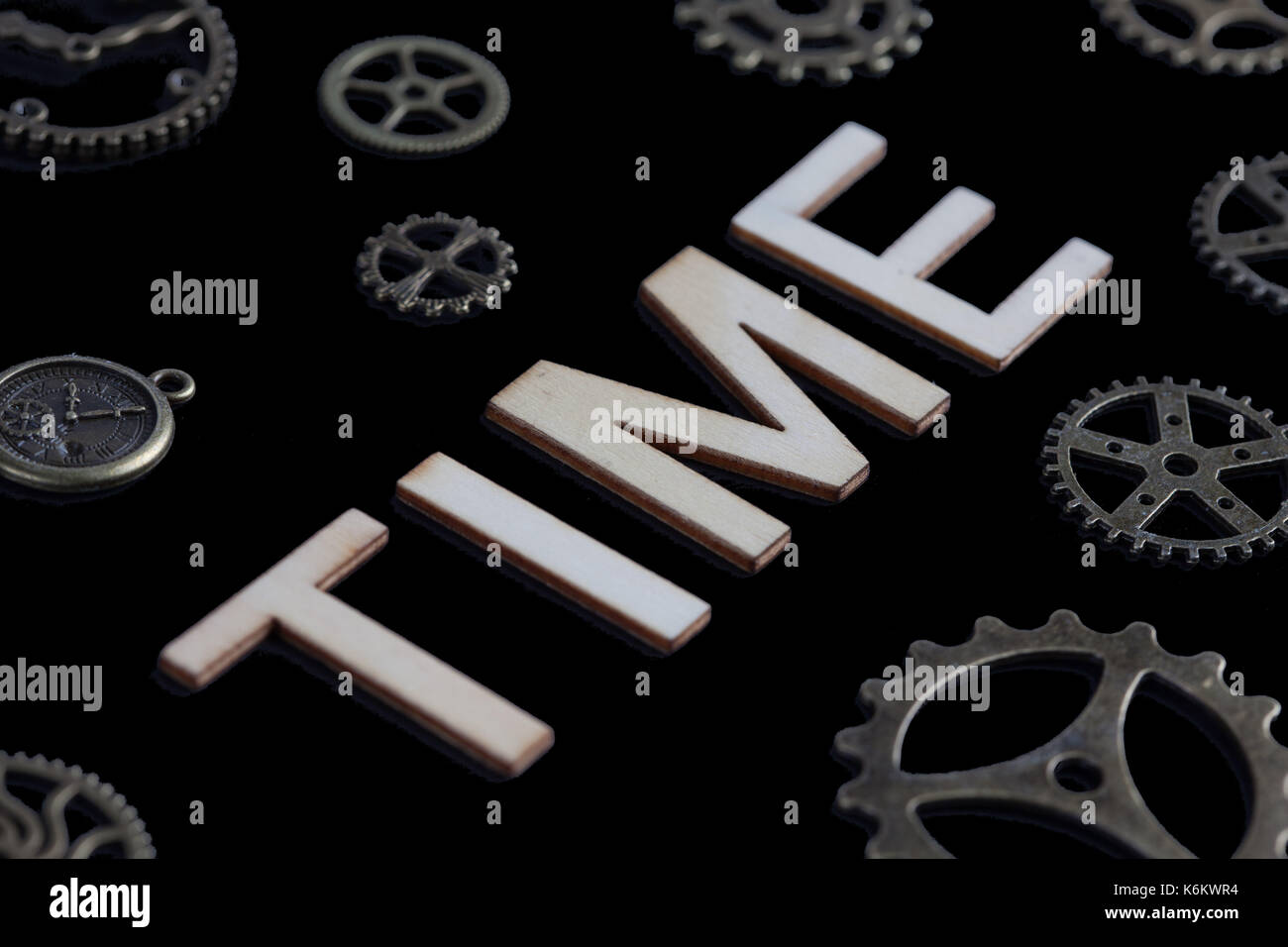 Concept of time depicted with cog wheels, watches and lettes isolated ...