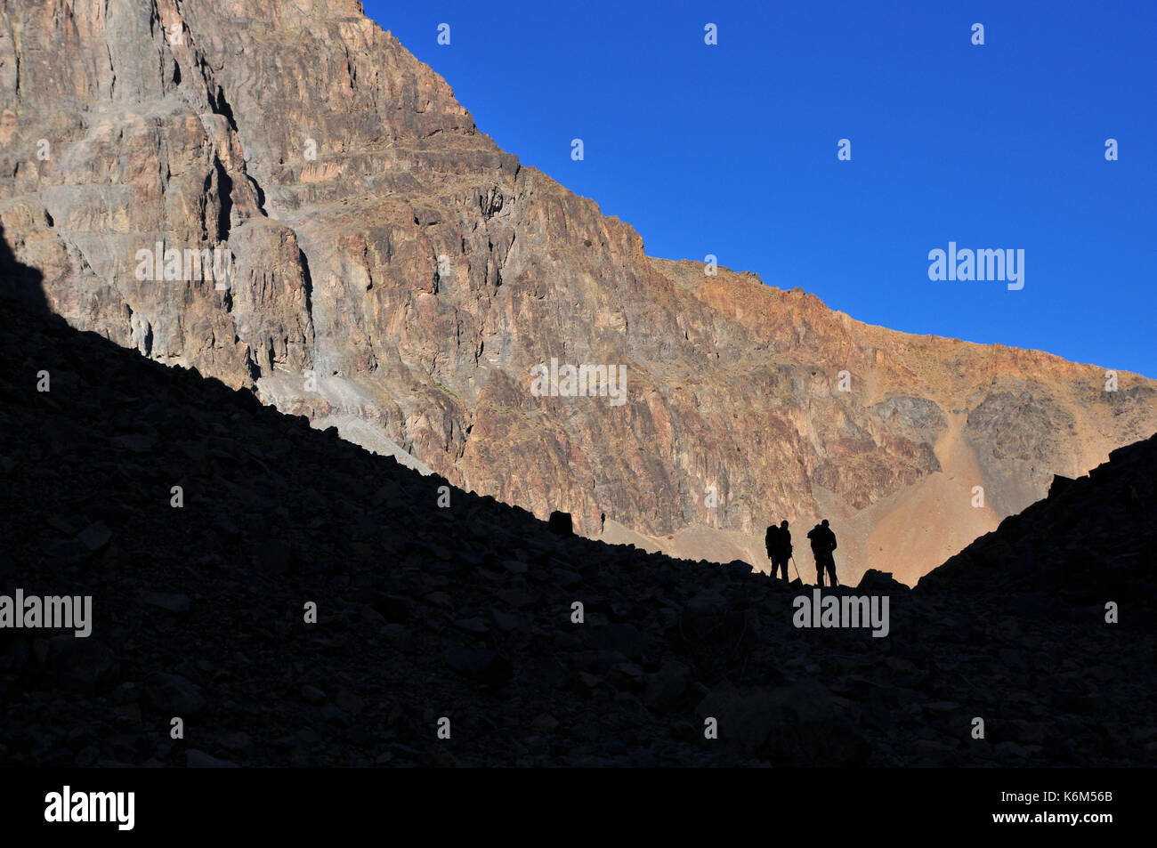 Morocco, North Africa, High Atlas Mountains. Two friends trekking on ...
