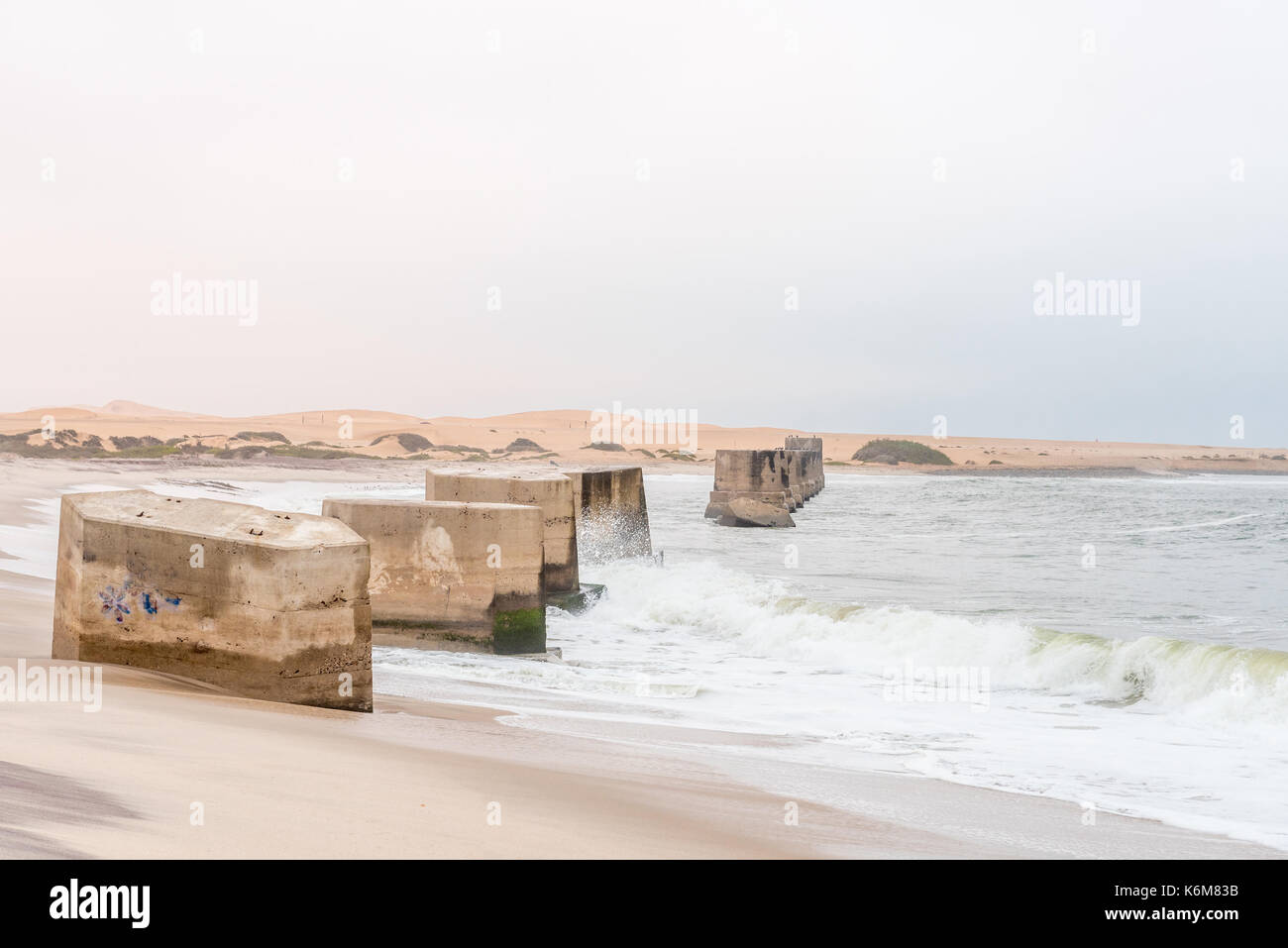 Pillars of the old railroad bridge over the mouth of the Swakop River ...
