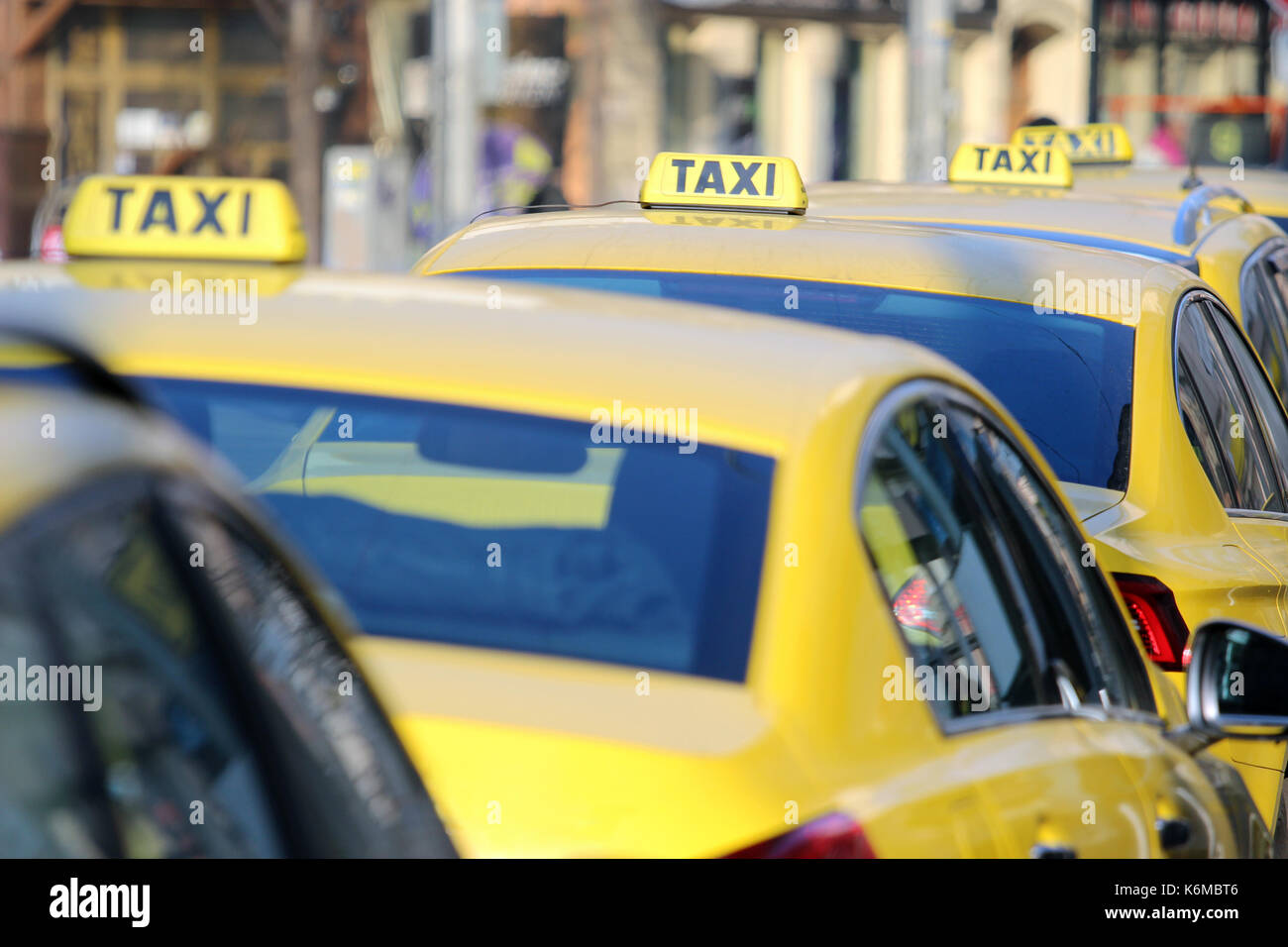 Yellow taxi in line on the street Stock Photo - Alamy