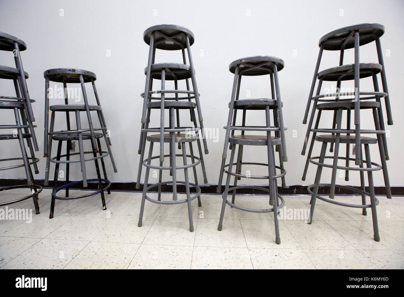 Stacked metal stools Stock Photo - Alamy