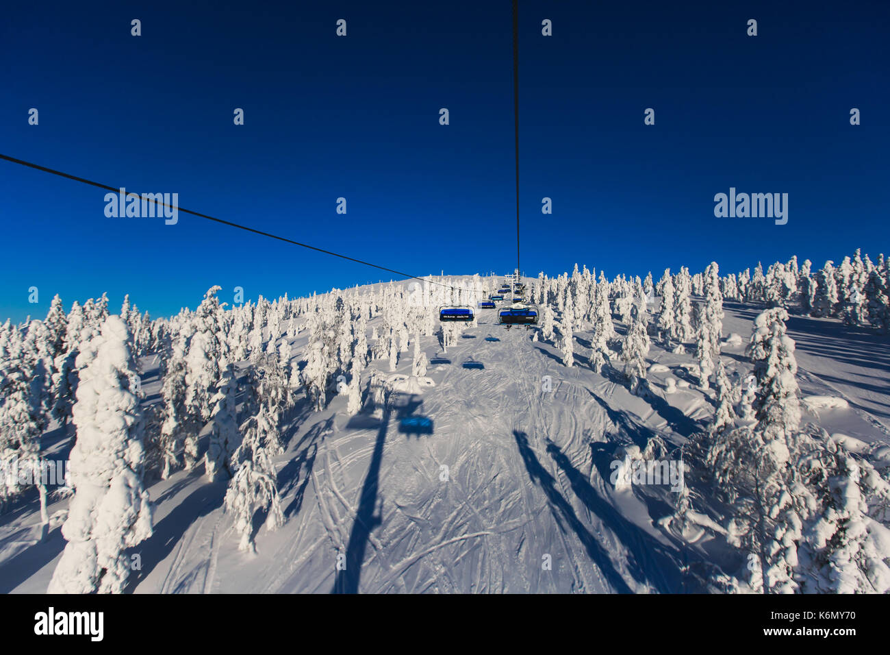 Beautiful cold mountain view of ski resort, sunny winter day with slope ...