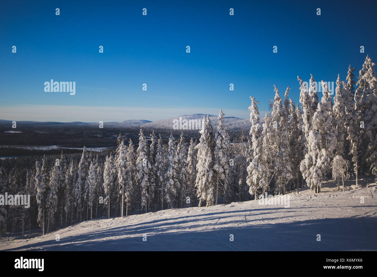 Beautiful cold mountain view of ski resort, sunny winter day with slope ...