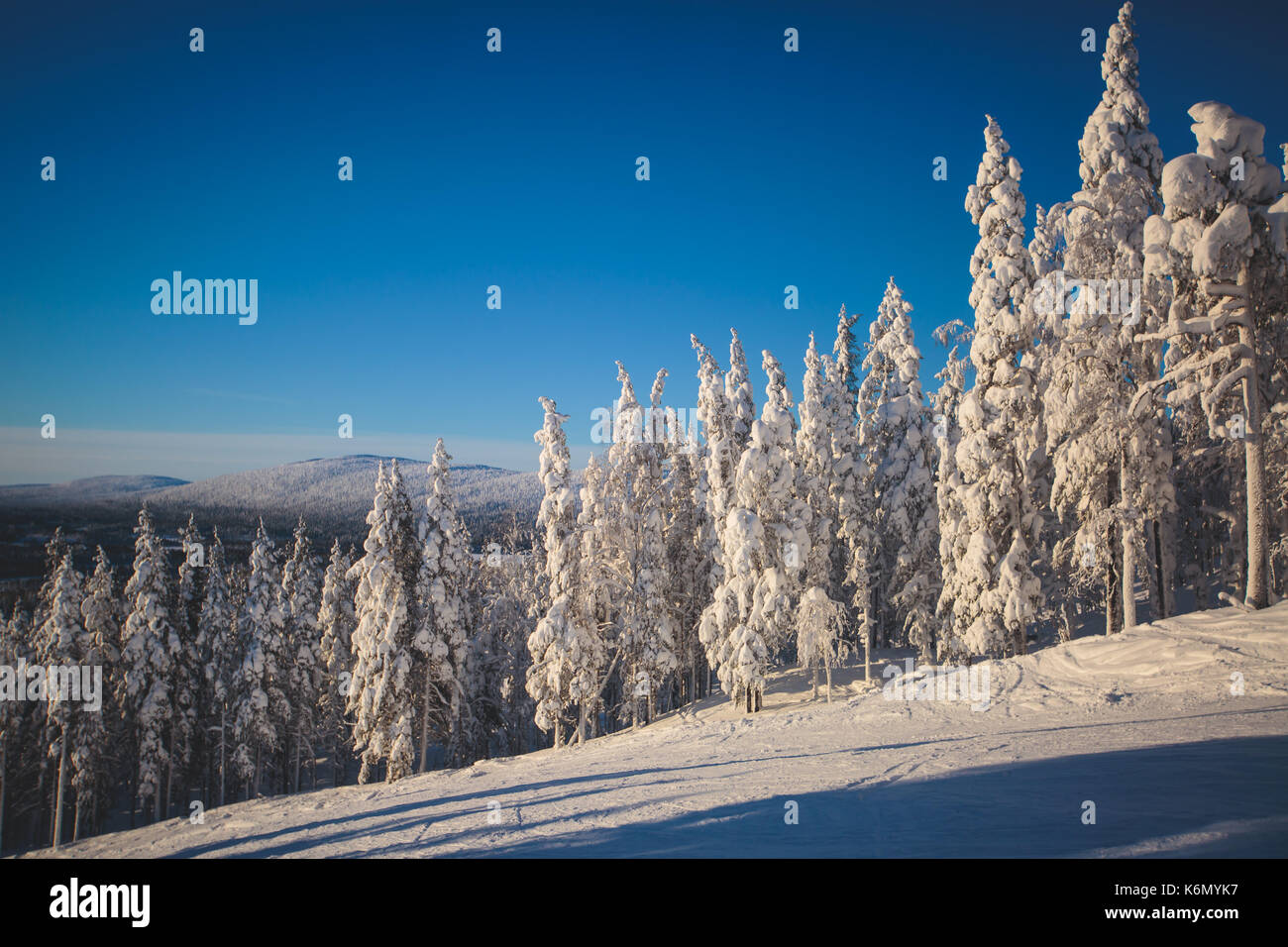 Beautiful cold mountain view of ski resort, sunny winter day with slope ...