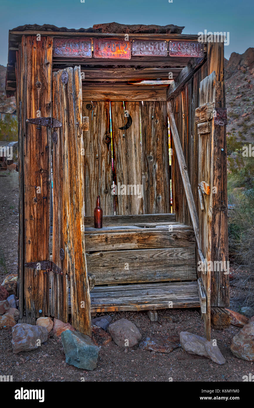 Western Outhouse - Rustic wooden outhouse outhouse with an empty bottle ...