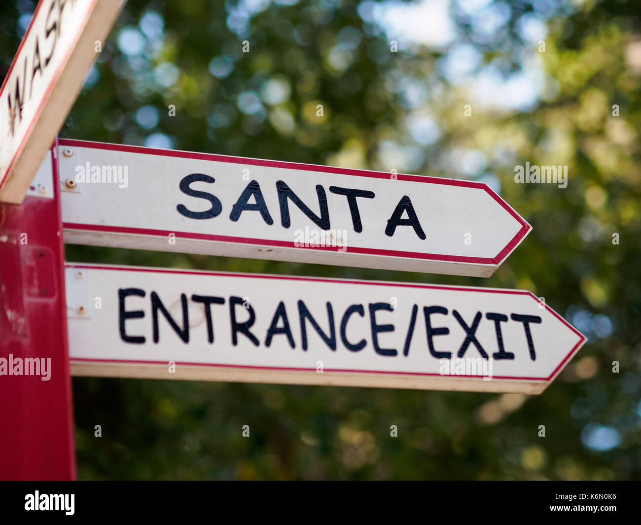 A signpost showing directions to meet Santa Claus depicting where Santa ...