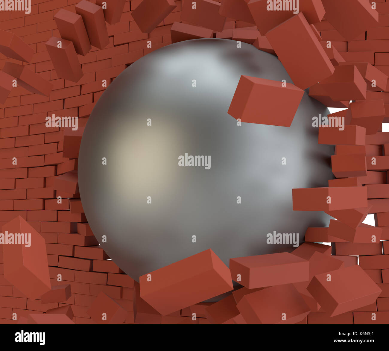 A metal ball broke the brick wall. Close-up Stock Photo - Alamy