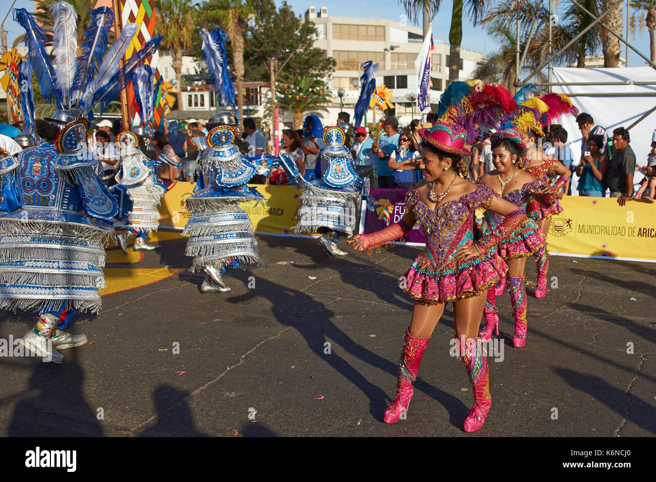 Female members of a Morenada dance group in ornate costumes performing ...