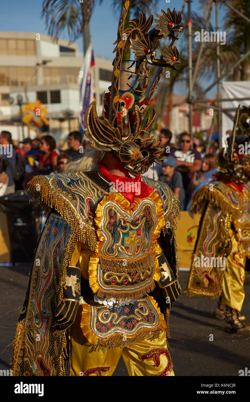 Masked Diablada dancers in ornate costume performing at the annual ...