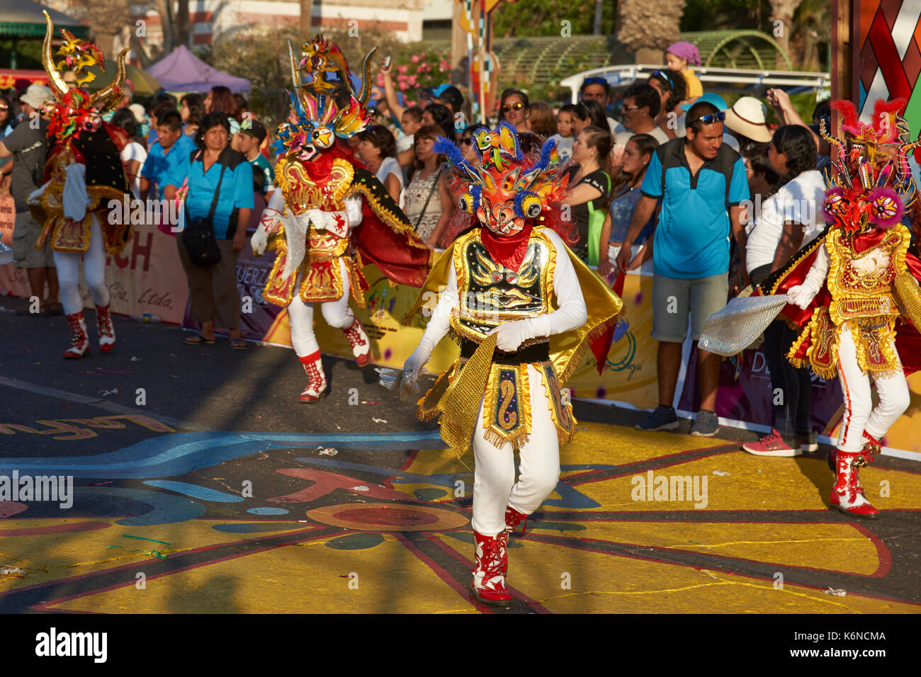 Masked Diablada dancers in ornate costume performing at the annual ...