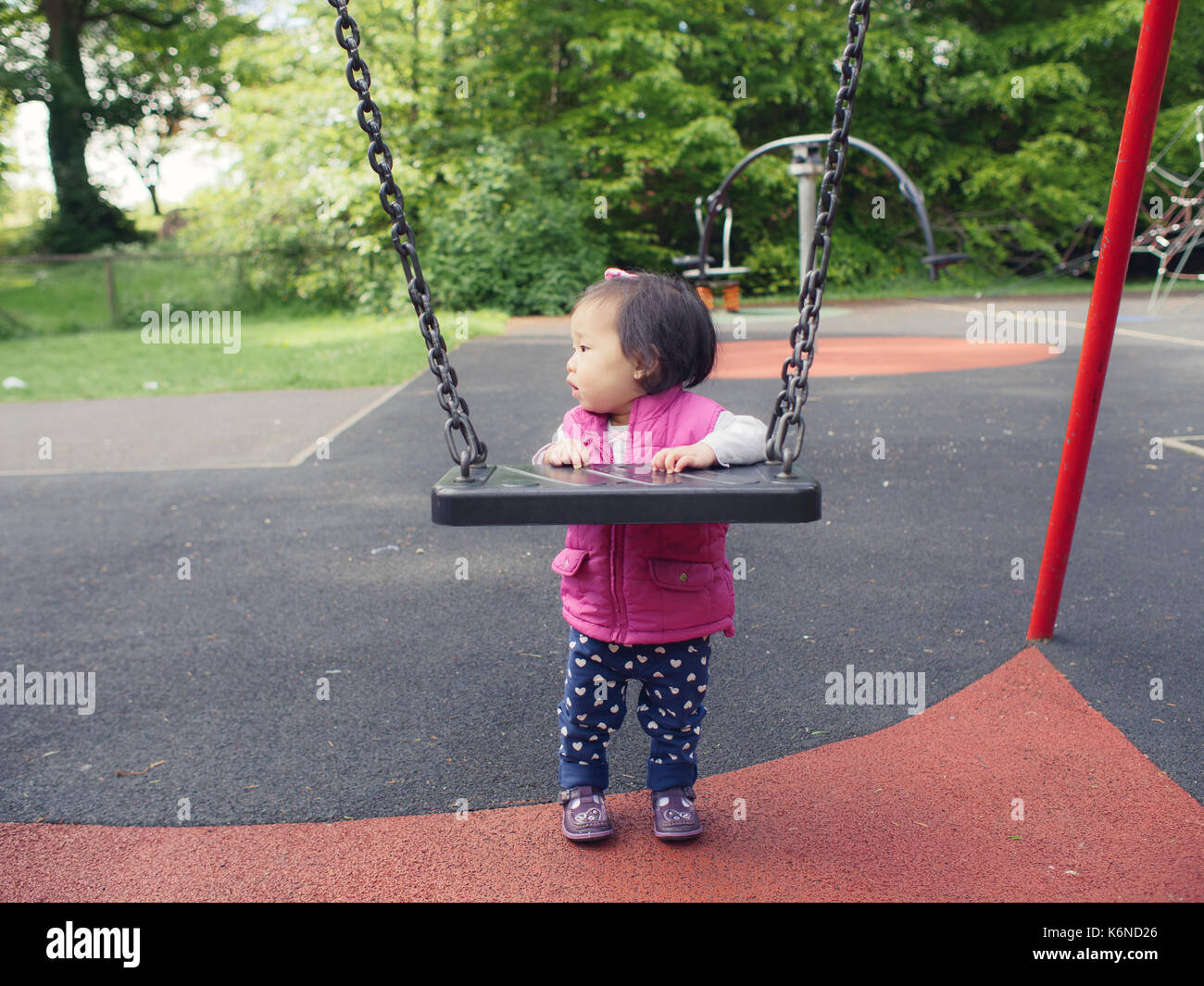baby girl playing in the playground Stock Photo - Alamy