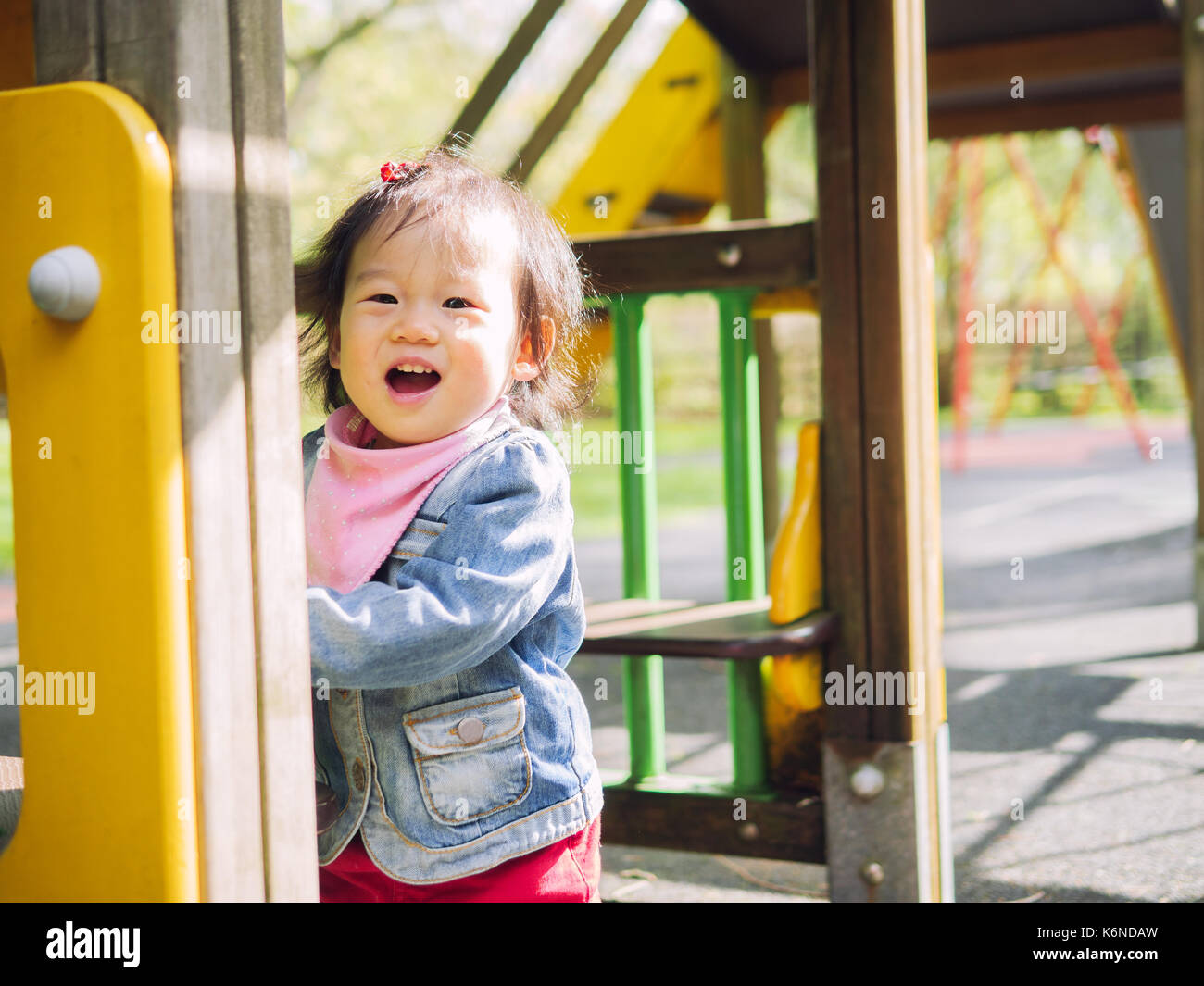 baby girl playing in the playground Stock Photo - Alamy