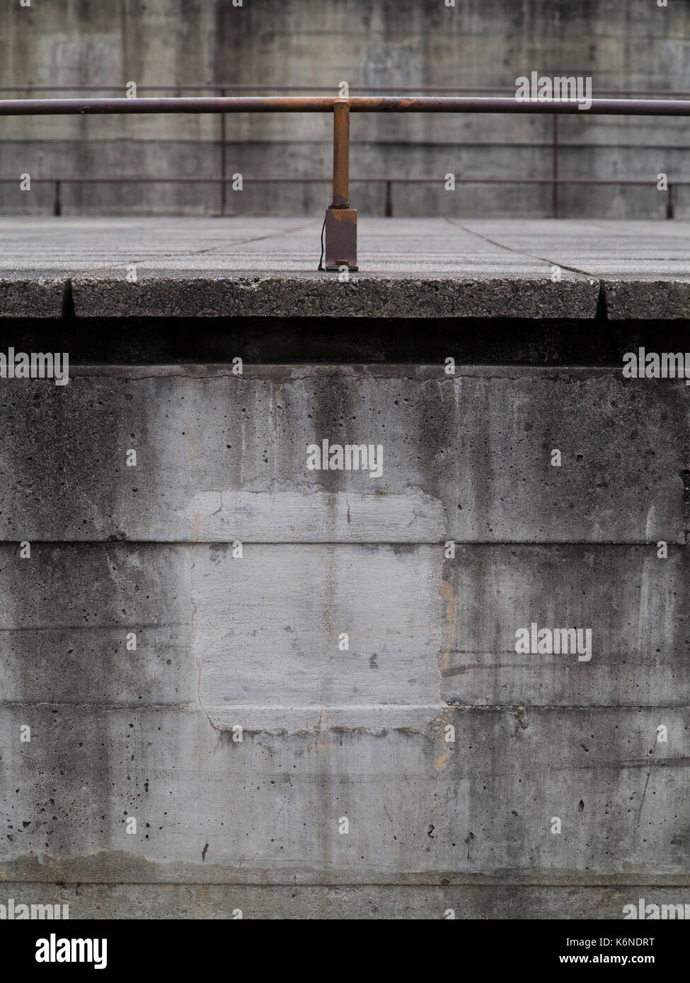 background concrete wall detail with tubular iron bar Stock Photo - Alamy