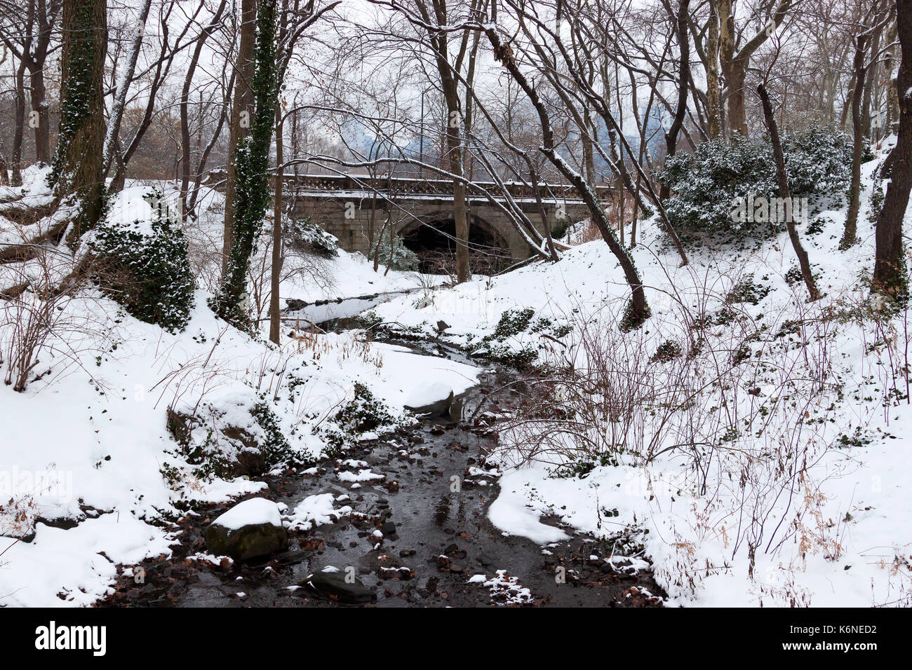 winter landscape - bridge over river with white snow in a park Stock ...
