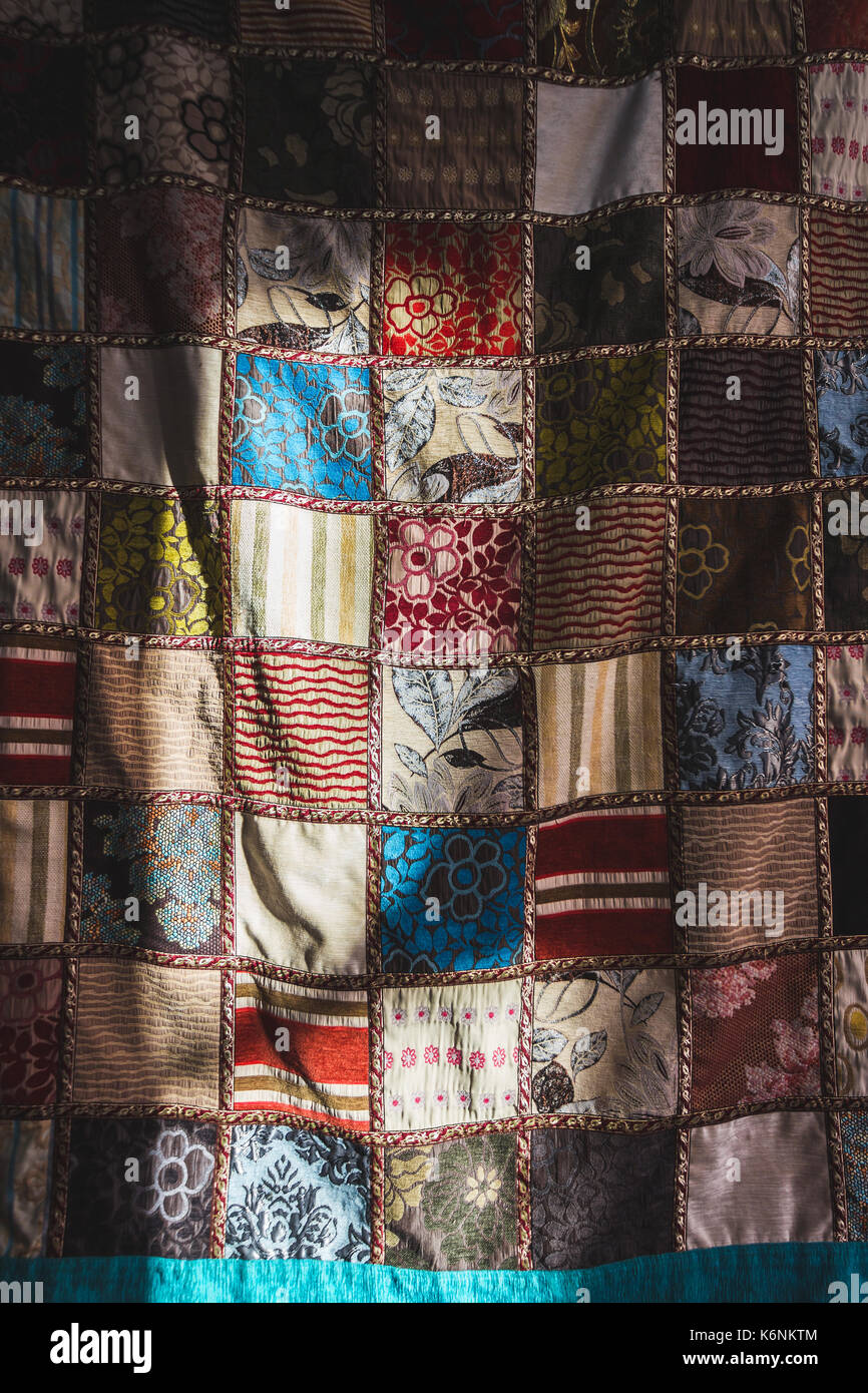 Beautiful color texture of handmade embroidered carpet, illuminated by ...