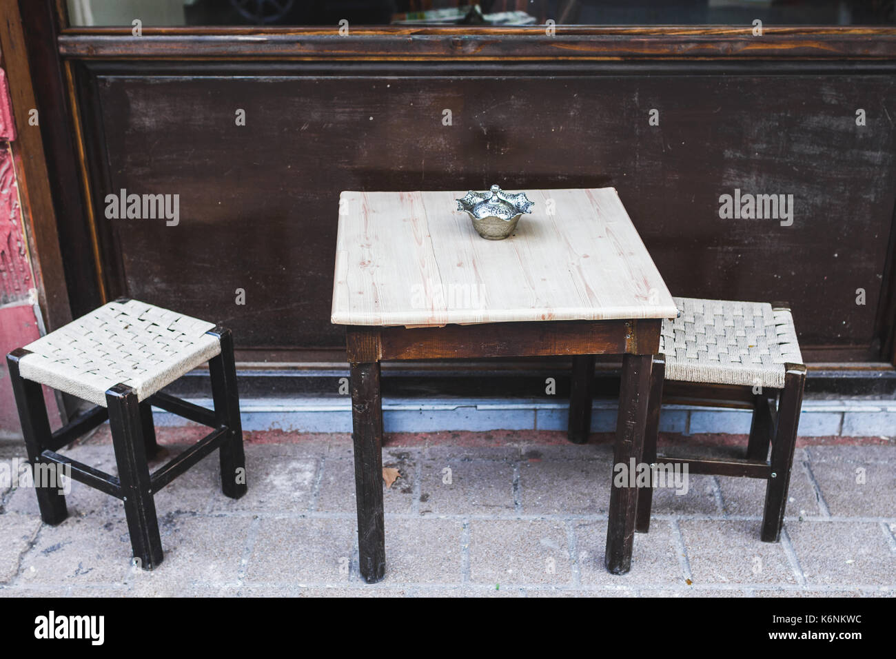 Traditional turkish street cafe with small table and chairs outside ...