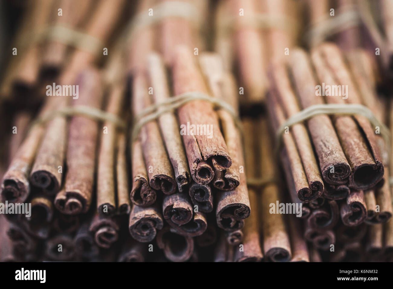 Stack of cinnamon sticks on the counter market Stock Photo - Alamy