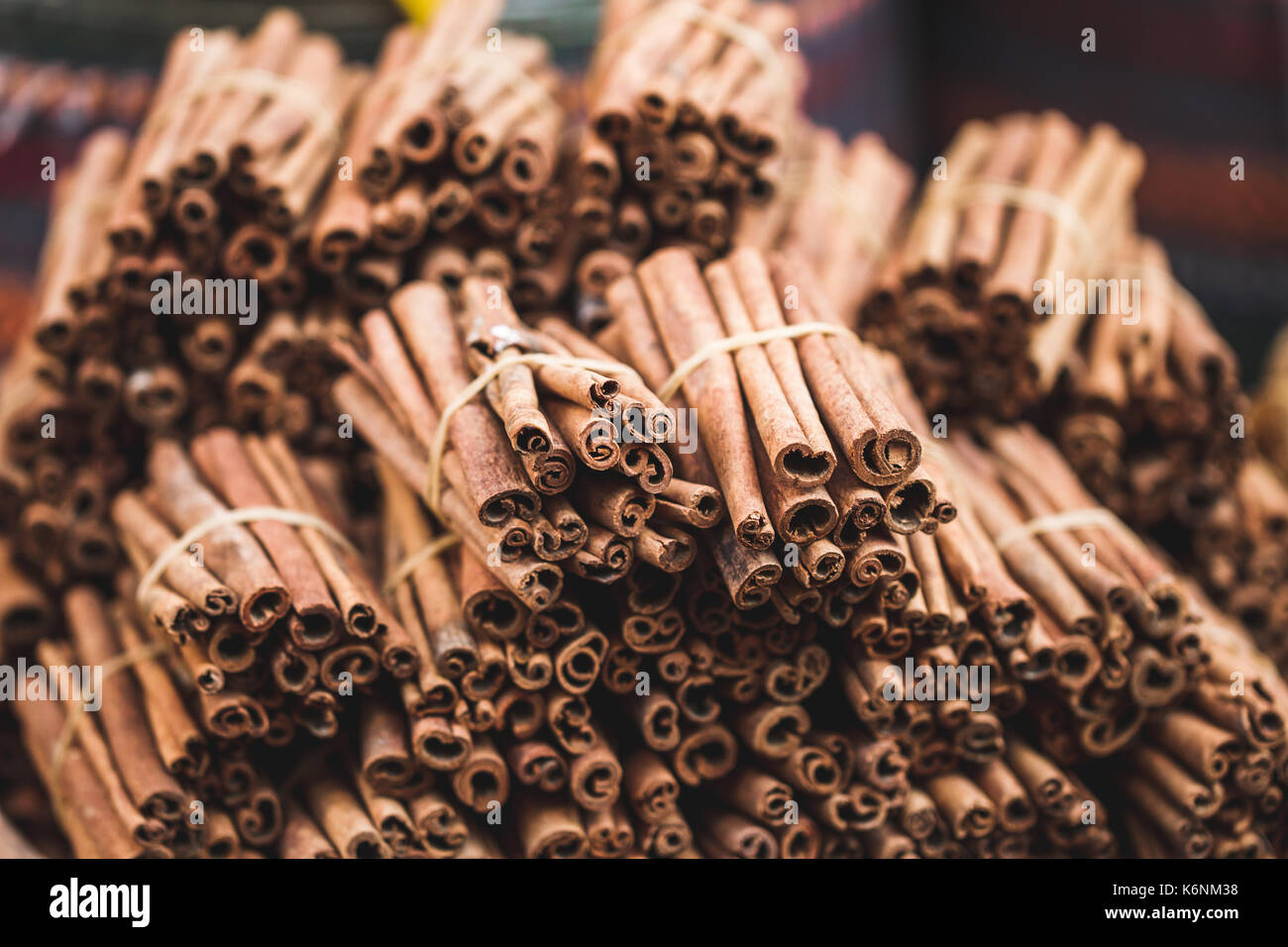 Stack of cinnamon sticks on the counter market Stock Photo - Alamy