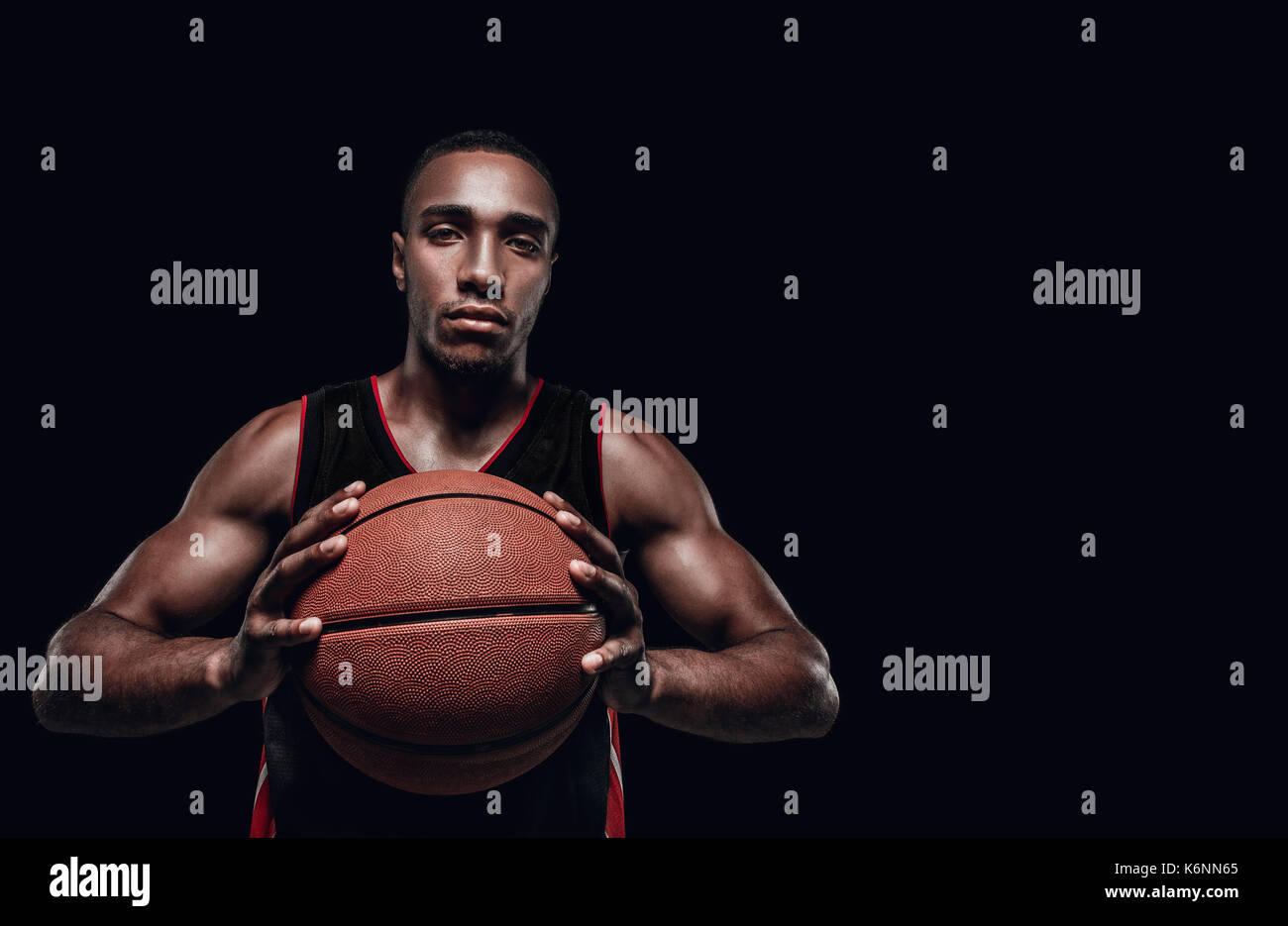 The portrait of a basketball player with ball Stock Photo - Alamy