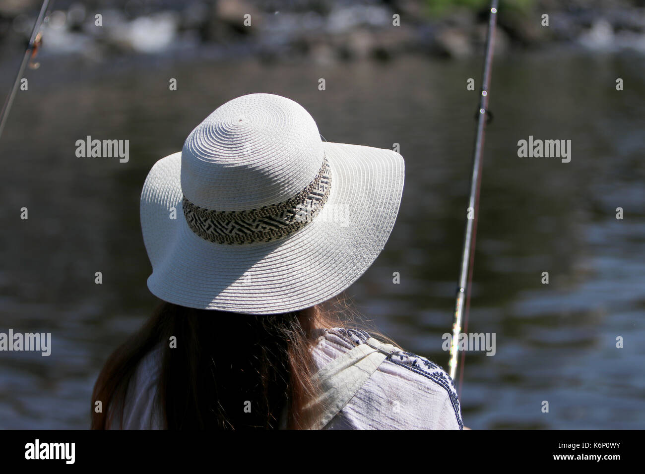 Woman with freckles and hot pants while fishing Stock Photo - Alamy