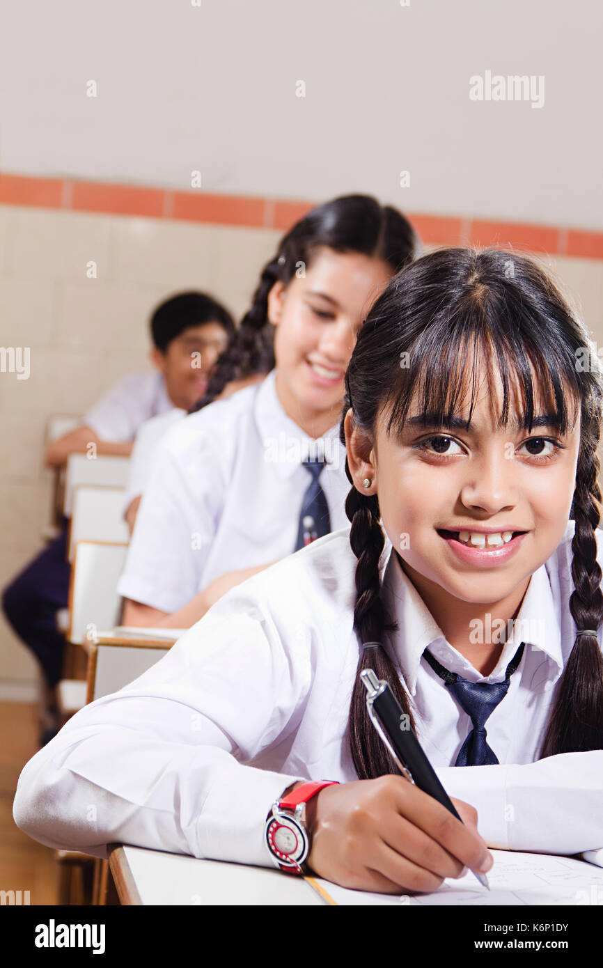 Smiling Indian School Kid Girl Student Note Book Writing Studying ...