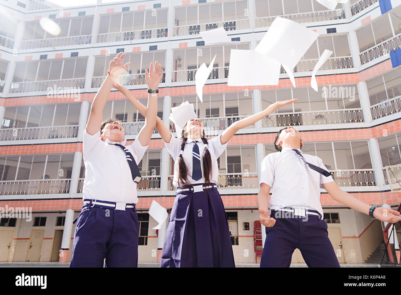 Happy Successful Teenager School Students Throwing Papers Celebration ...
