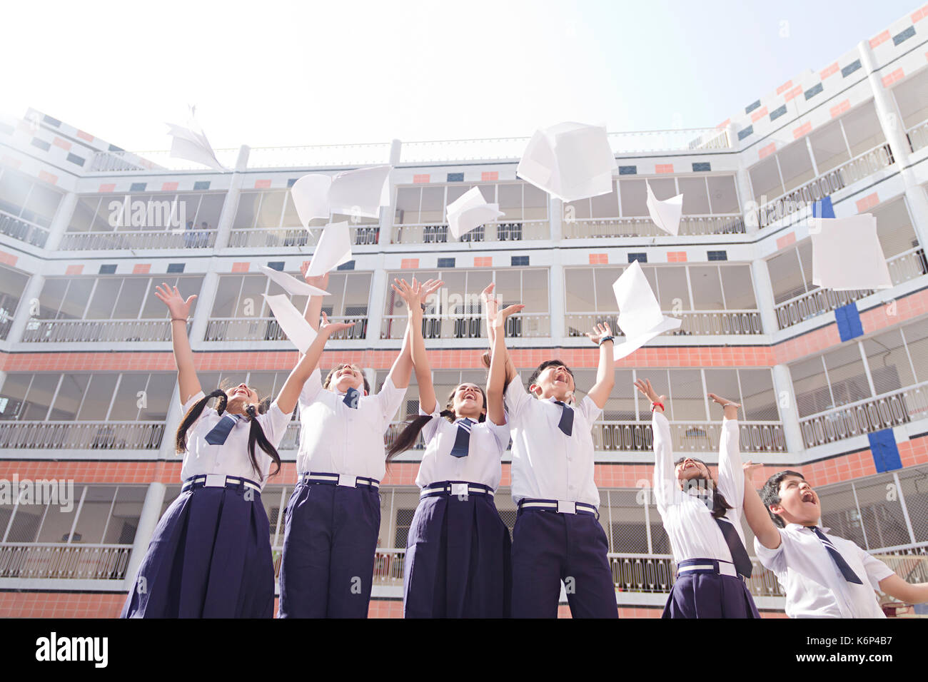Happy Group Successful Young School Students Throwing Papers ...