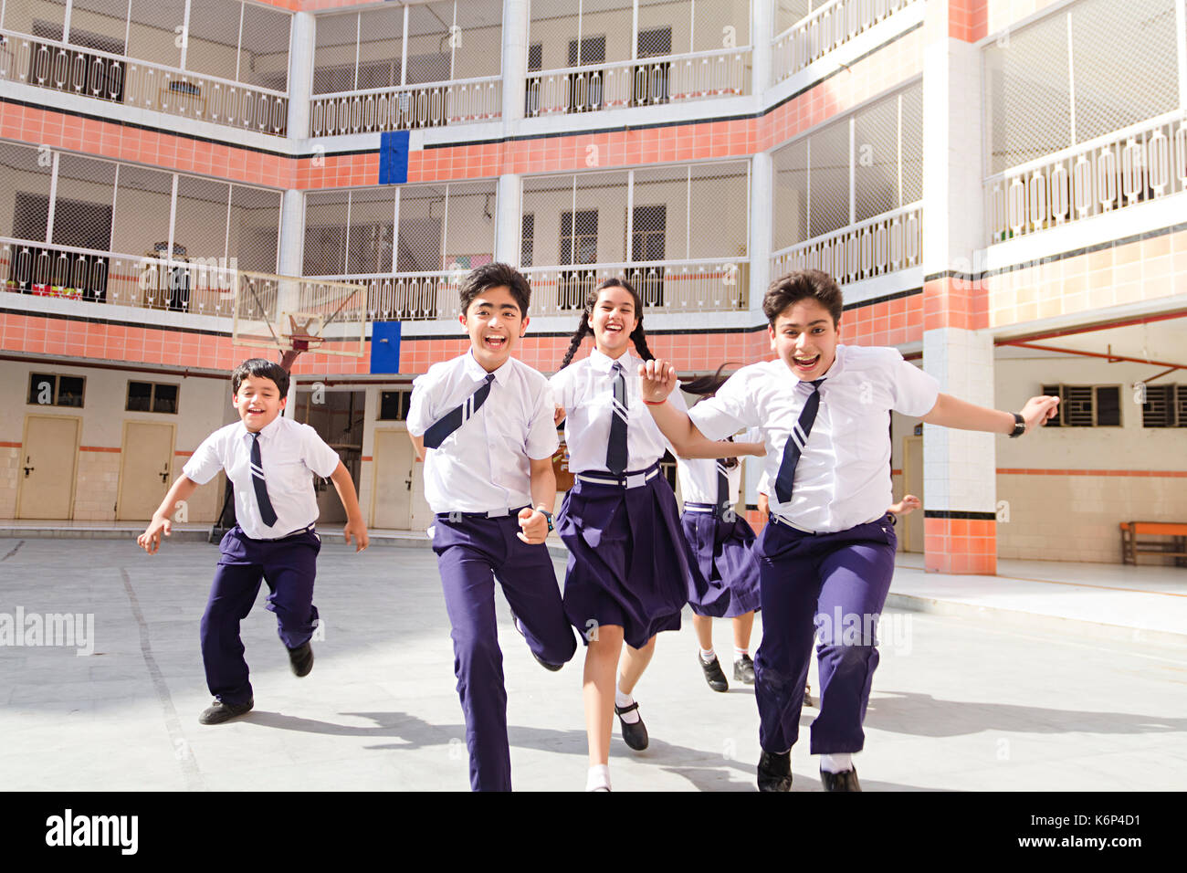 Happy Group School Students Running Together School Courtyard Cheerful ...