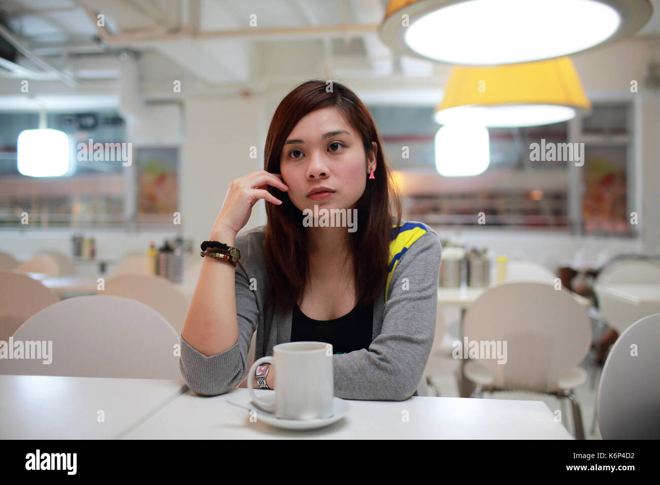 business woman space out at restaurant Stock Photo - Alamy