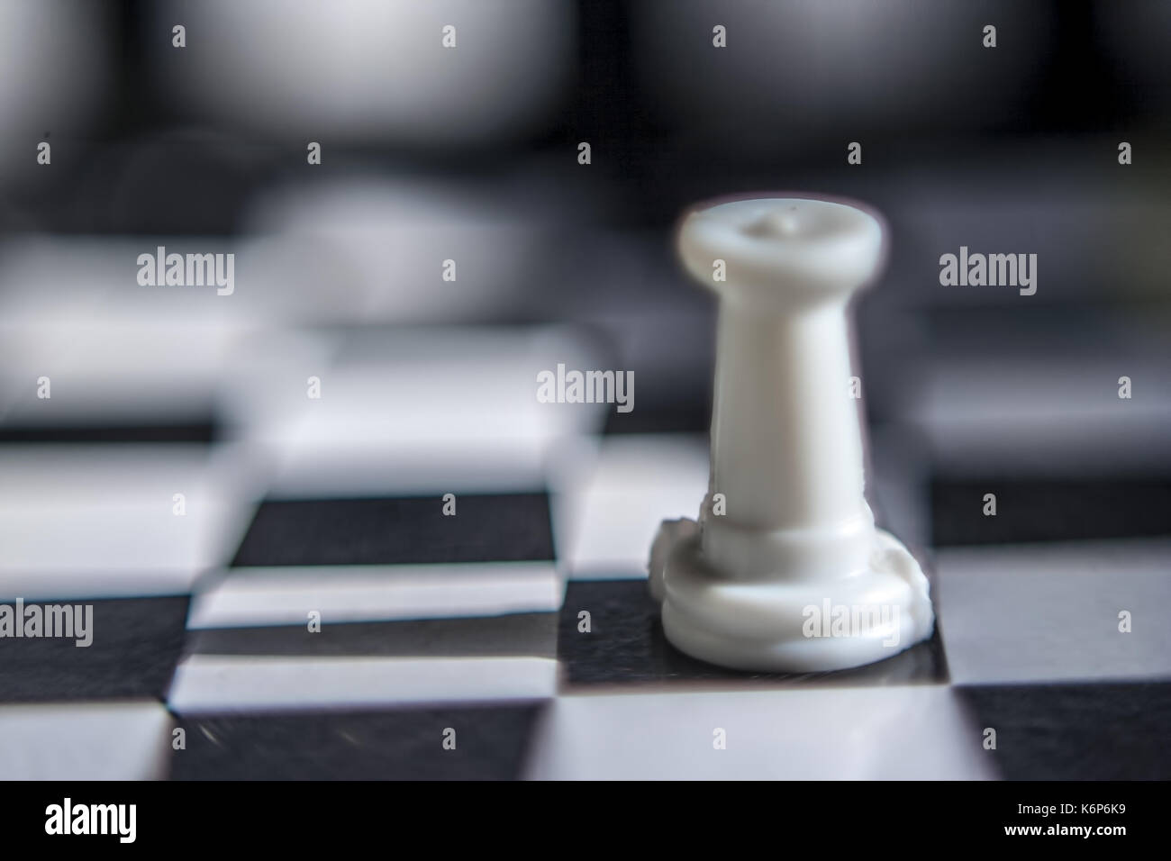 A white rook fallen on the chess board Stock Photo - Alamy