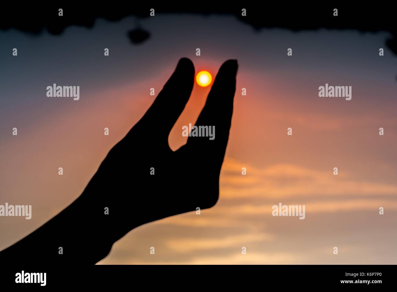 Sun in hand Stock Photo - Alamy