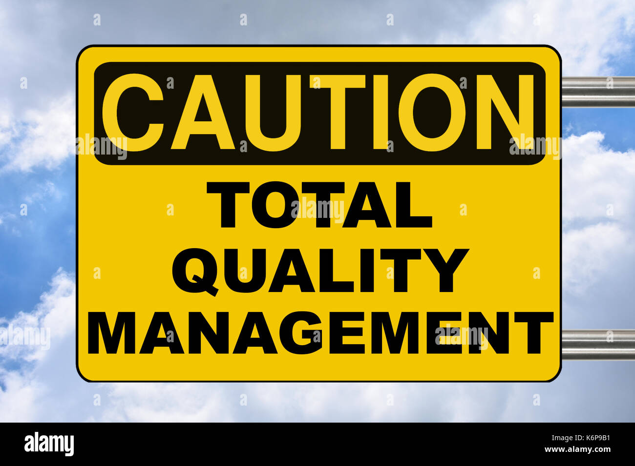 Total Quality Management, yellow warning street sign Stock Photo - Alamy