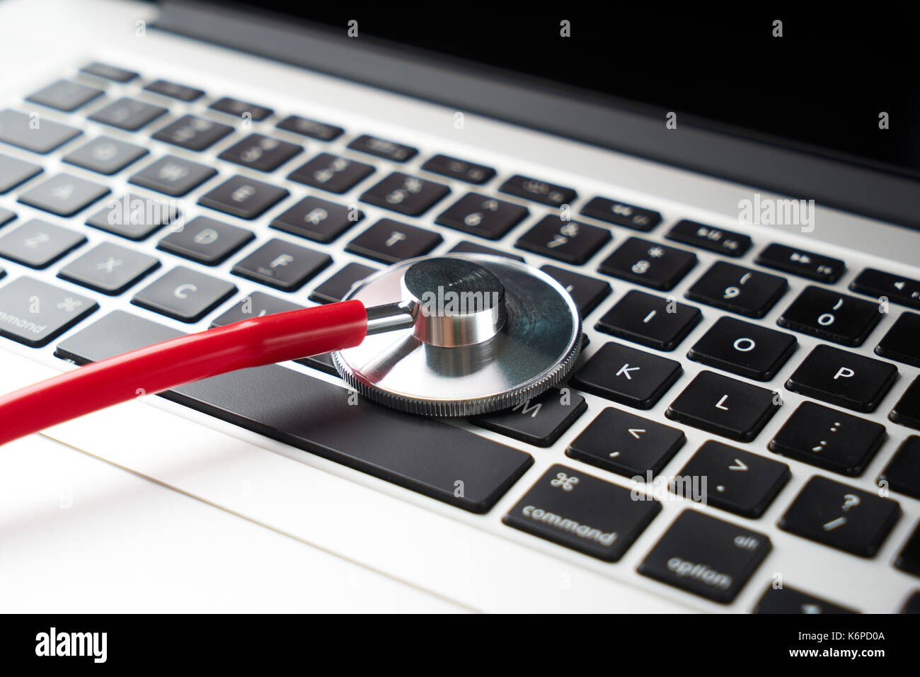 Closeup laptop diagnosis with a stethoscope. computer repair and ...