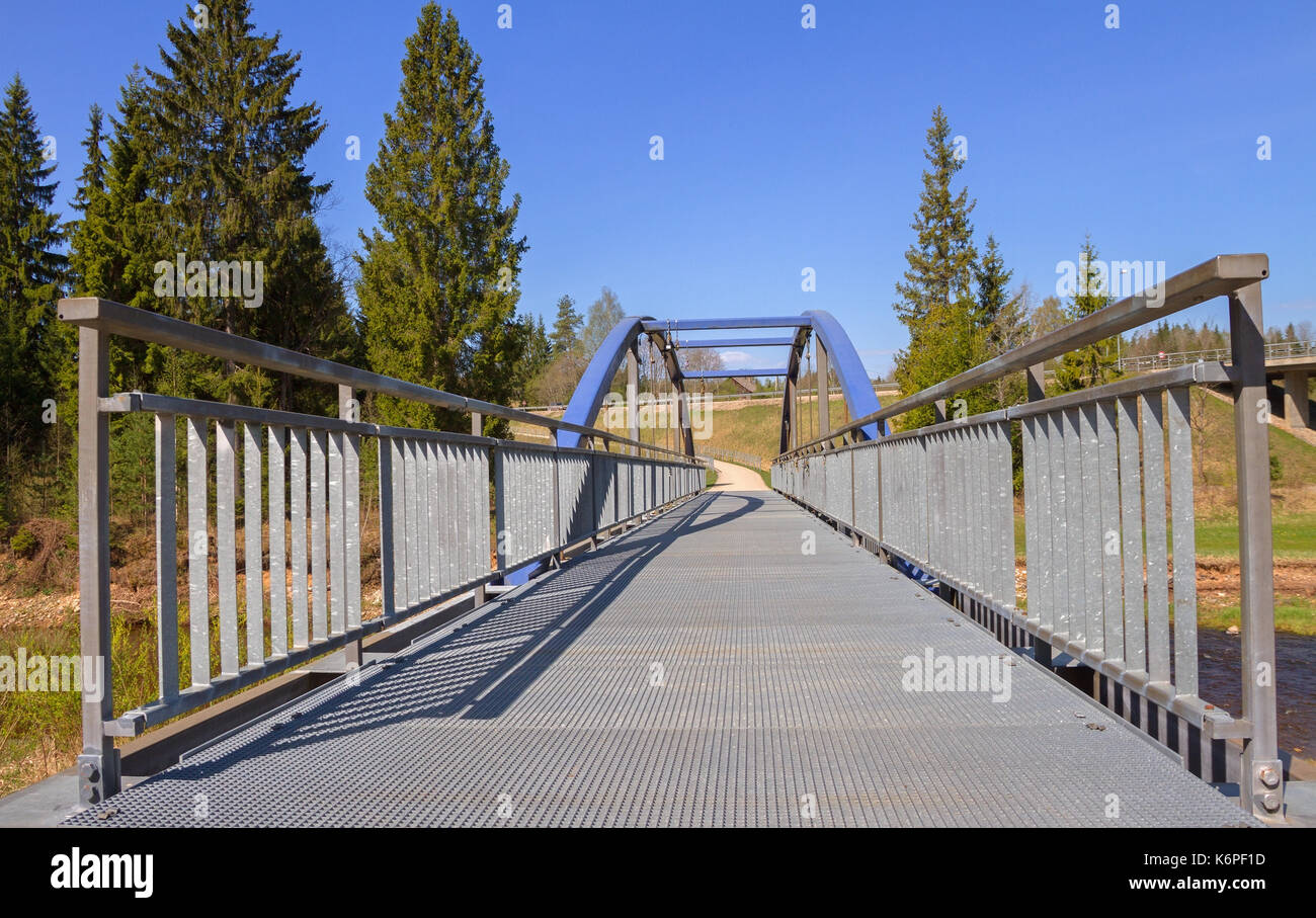 Metal bridge above river of Amata, Latvia Stock Photo - Alamy