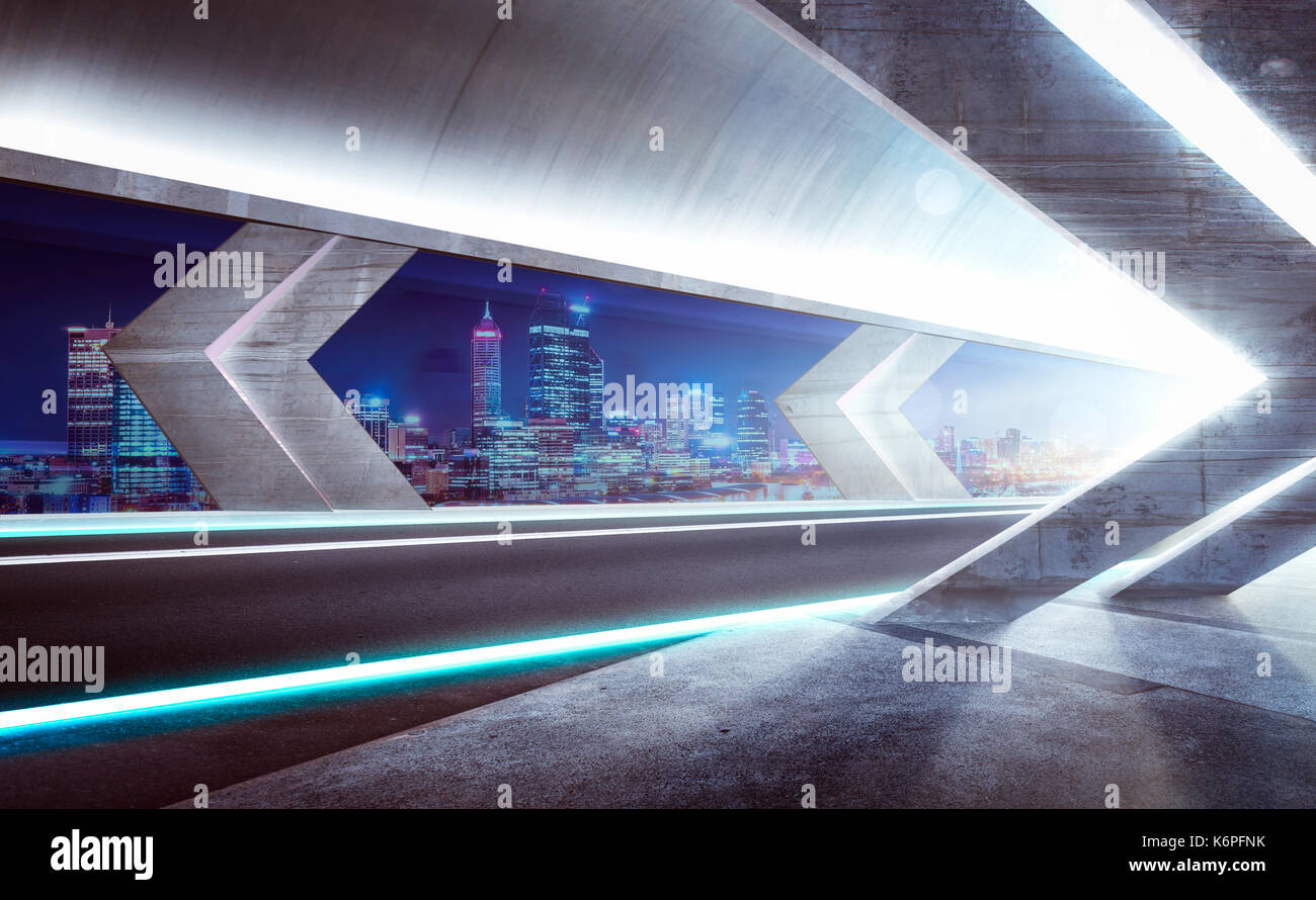 Modern asphalt road in glass tunnel with beautiful city skyline ...