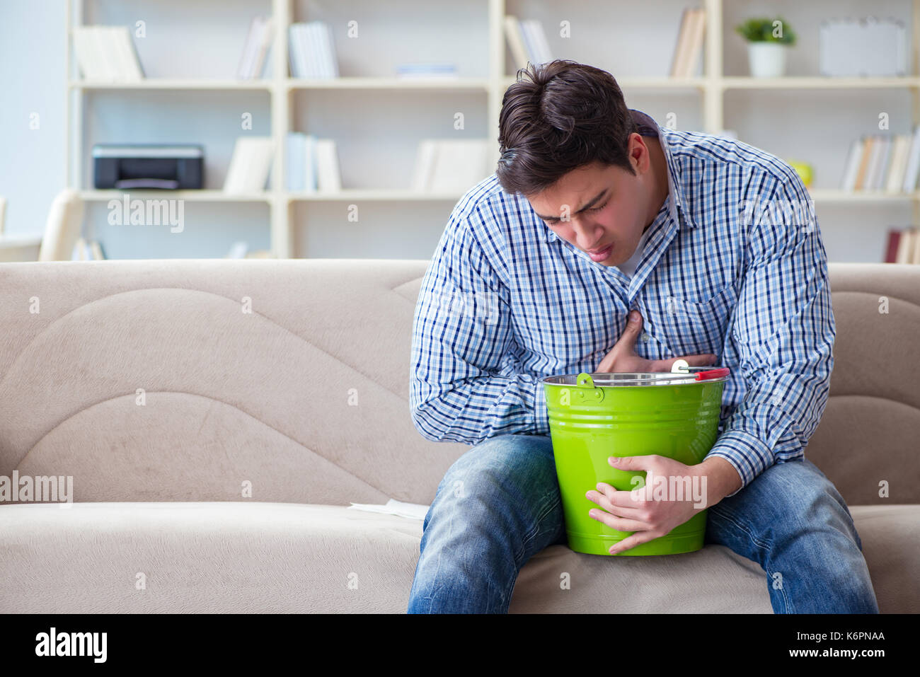 Man suffering from sick stomach and vomiting Stock Photo - Alamy
