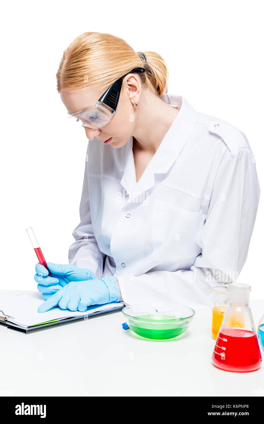 Concentrated microbiologist with a test tube while working Stock Photo ...