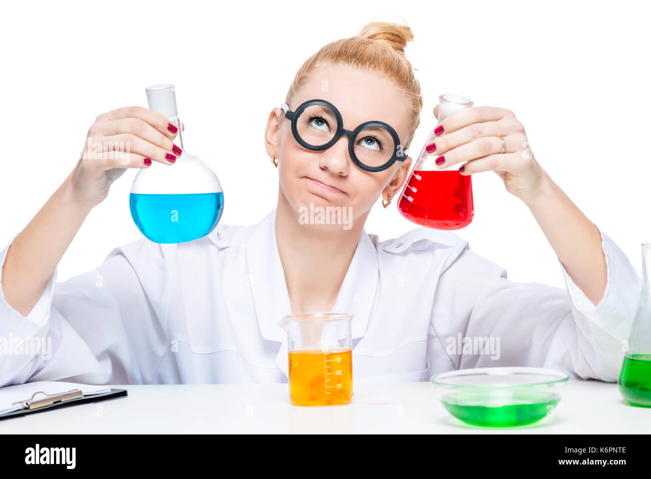 Beautiful crazy biologist chemist with test tubes thinks about the ...